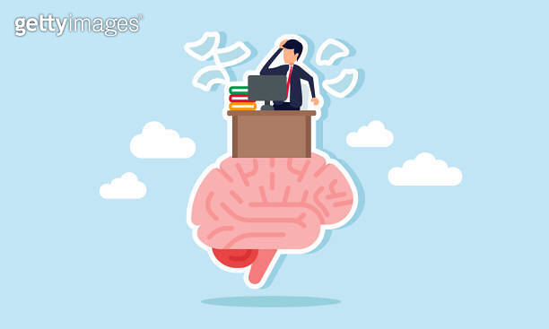 Businessman feels confused at a work desk placed on top of a brain ...