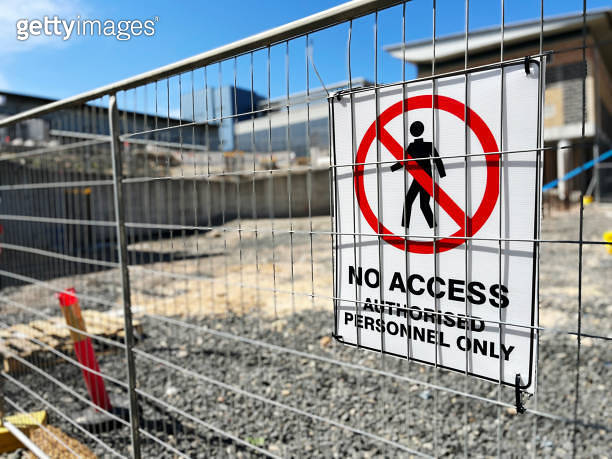 A “No Access: Authorised Personnel Only” warning sign with a red ...