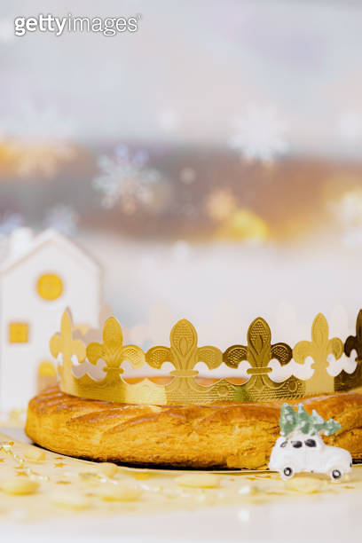 Delicious almond royal galette with crown on white table in kitchen ...