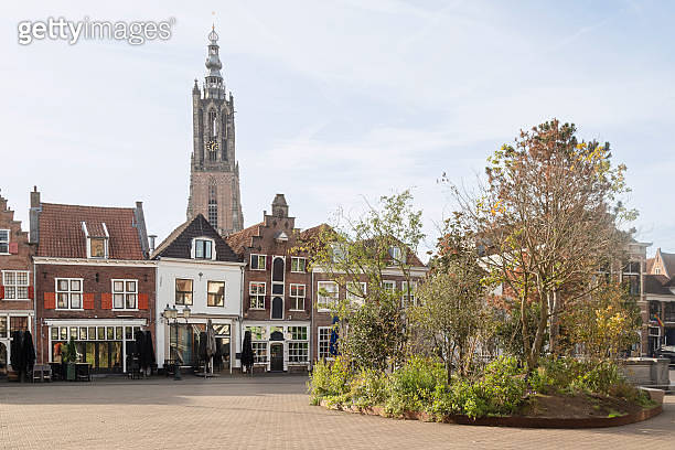 Old historic buildings on the town square De Hof, with the Our Lady ...